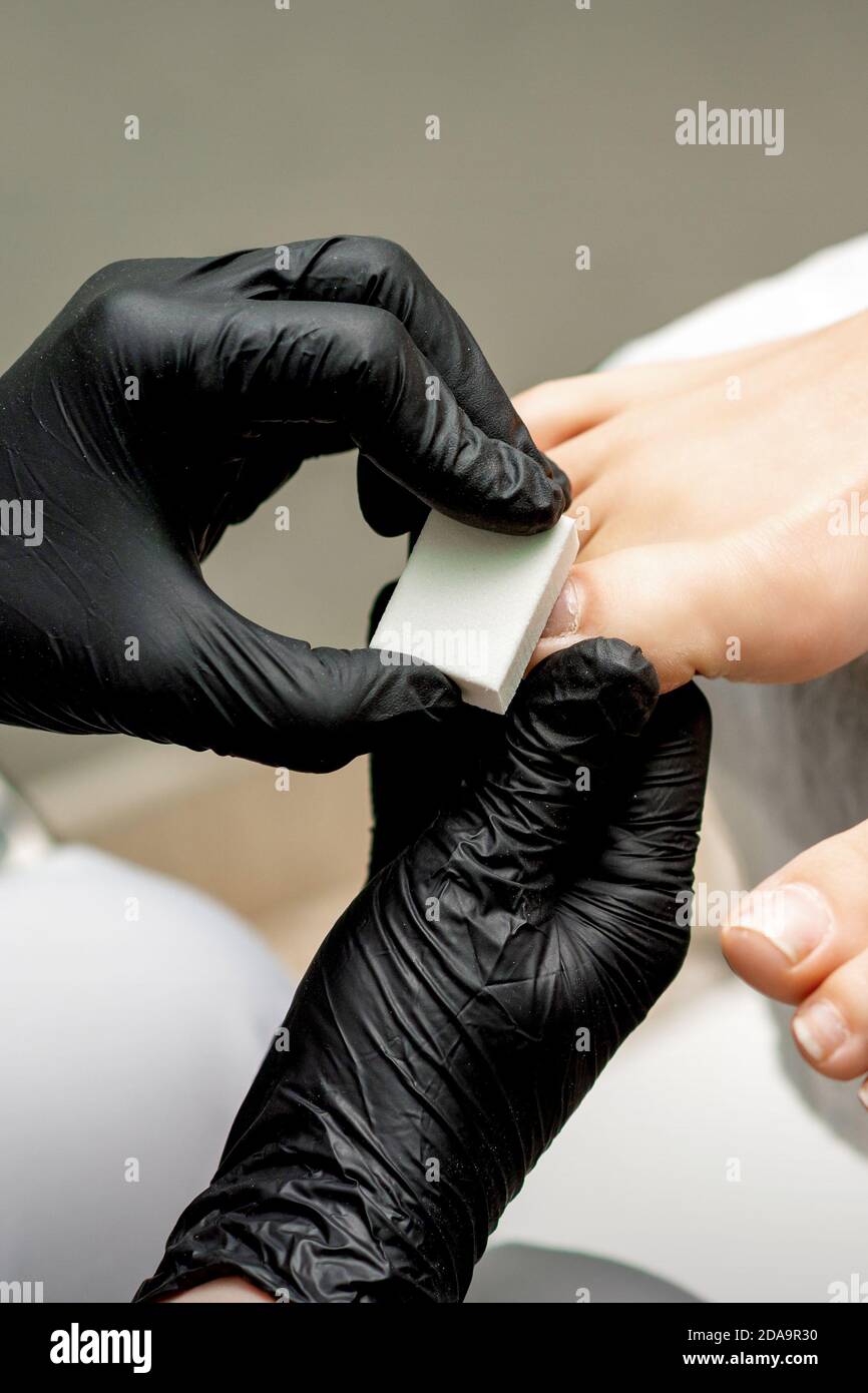 Woman nail buffing hi-res stock photography and images - Alamy