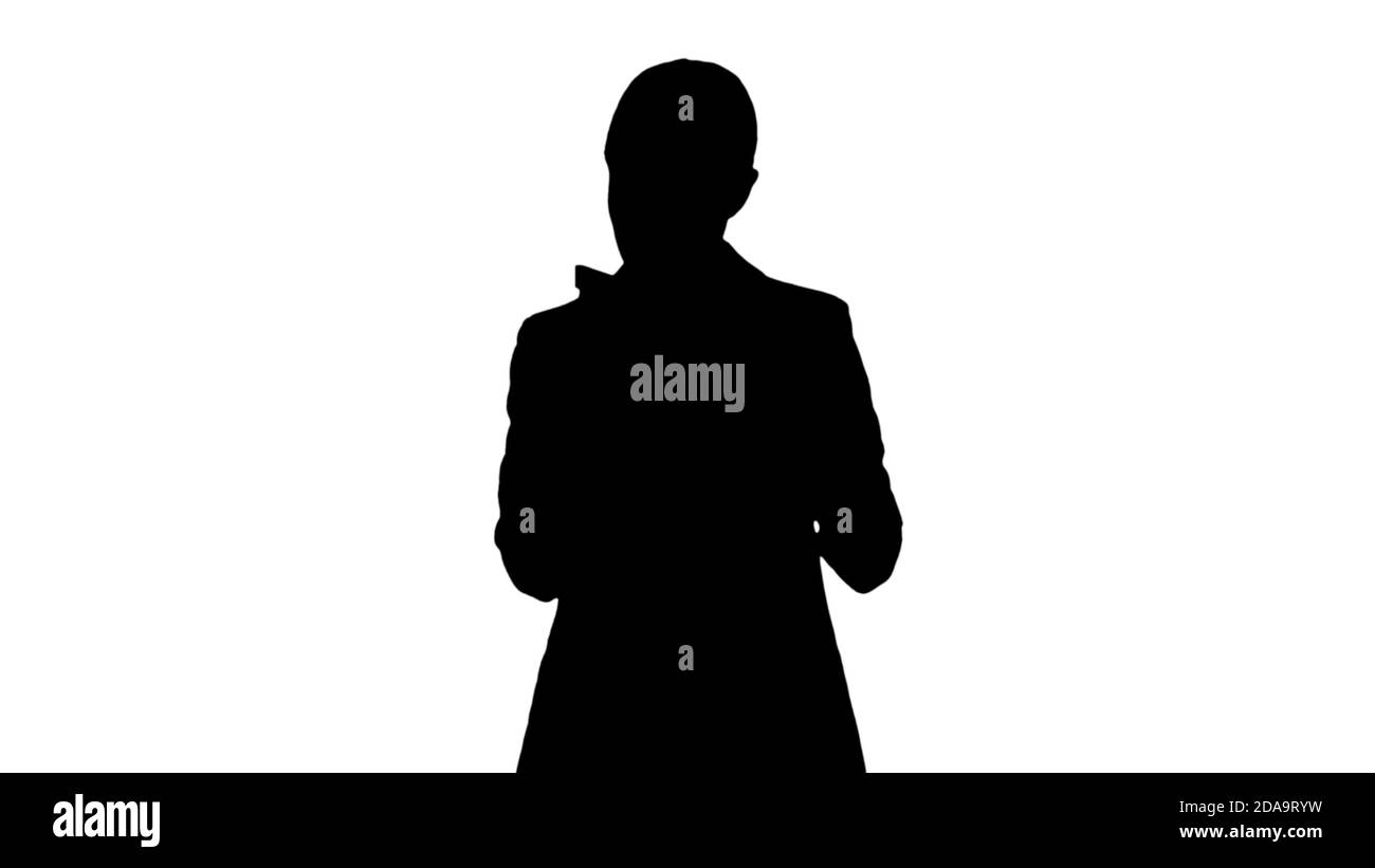 Silhouette Serious Businesswoman giving tasks talking on her pho Stock ...