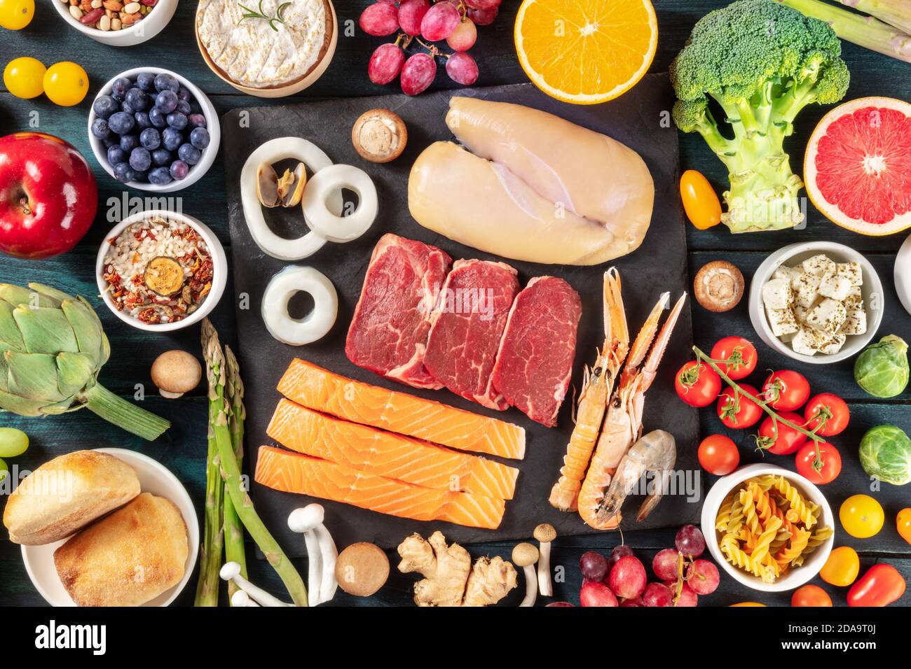 Food, overhead shot. Meat, fish, poultry, seafood, cheese, fruit and ...