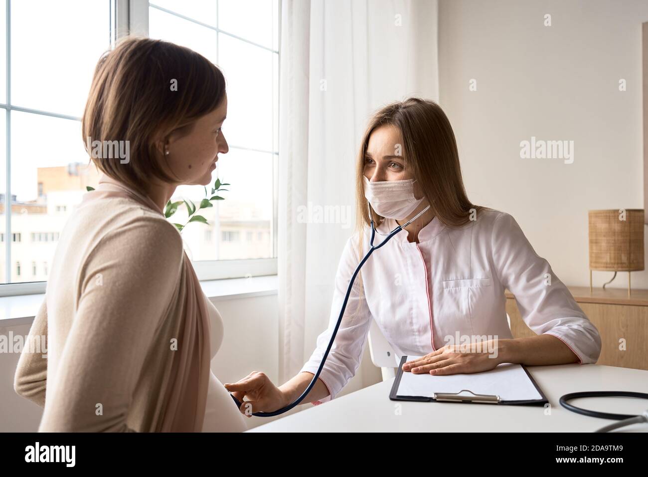 happy-pregnant-woman-visit-gynecologist-doctor-at-hospital-or-medical