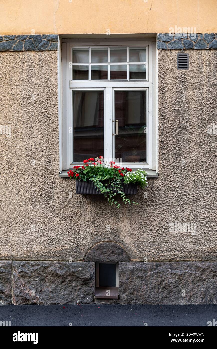 Flowers on a window ledge in peaceful Kruununhaka district of Helsinki ...
