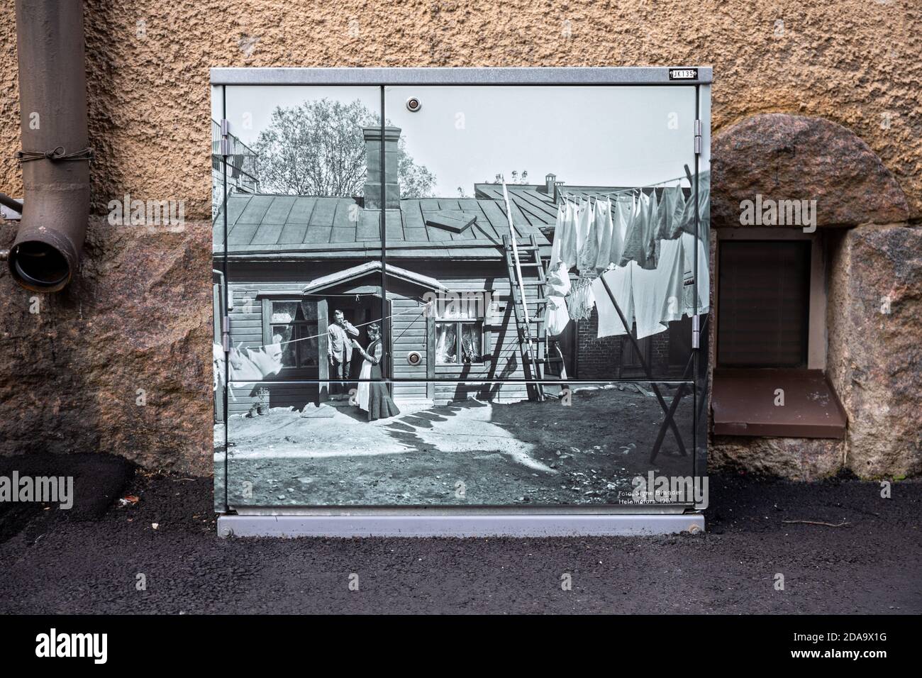 Electrical street cabinet with Signe Brander's image from 1907 showing ...