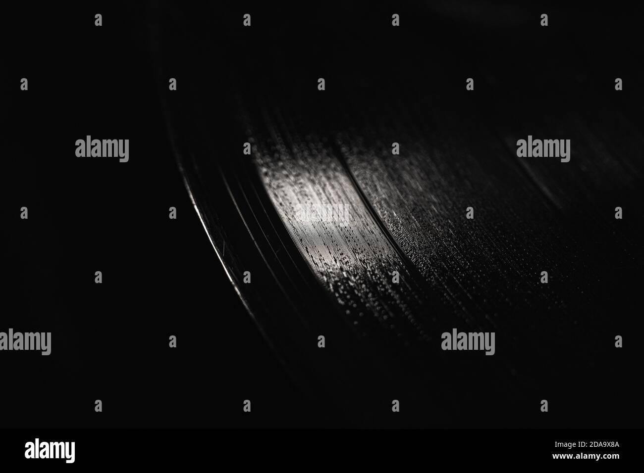 vinyl record on a black background macro photo Stock Photo - Alamy