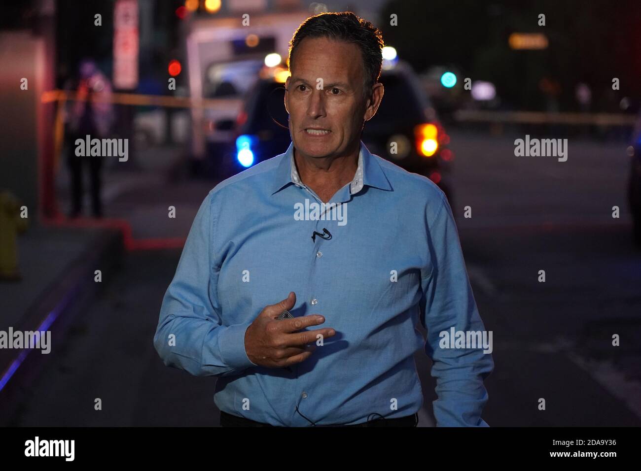 Fox 11 News Los Angeles reporter Ed Laskos outside the gated Hall of ...
