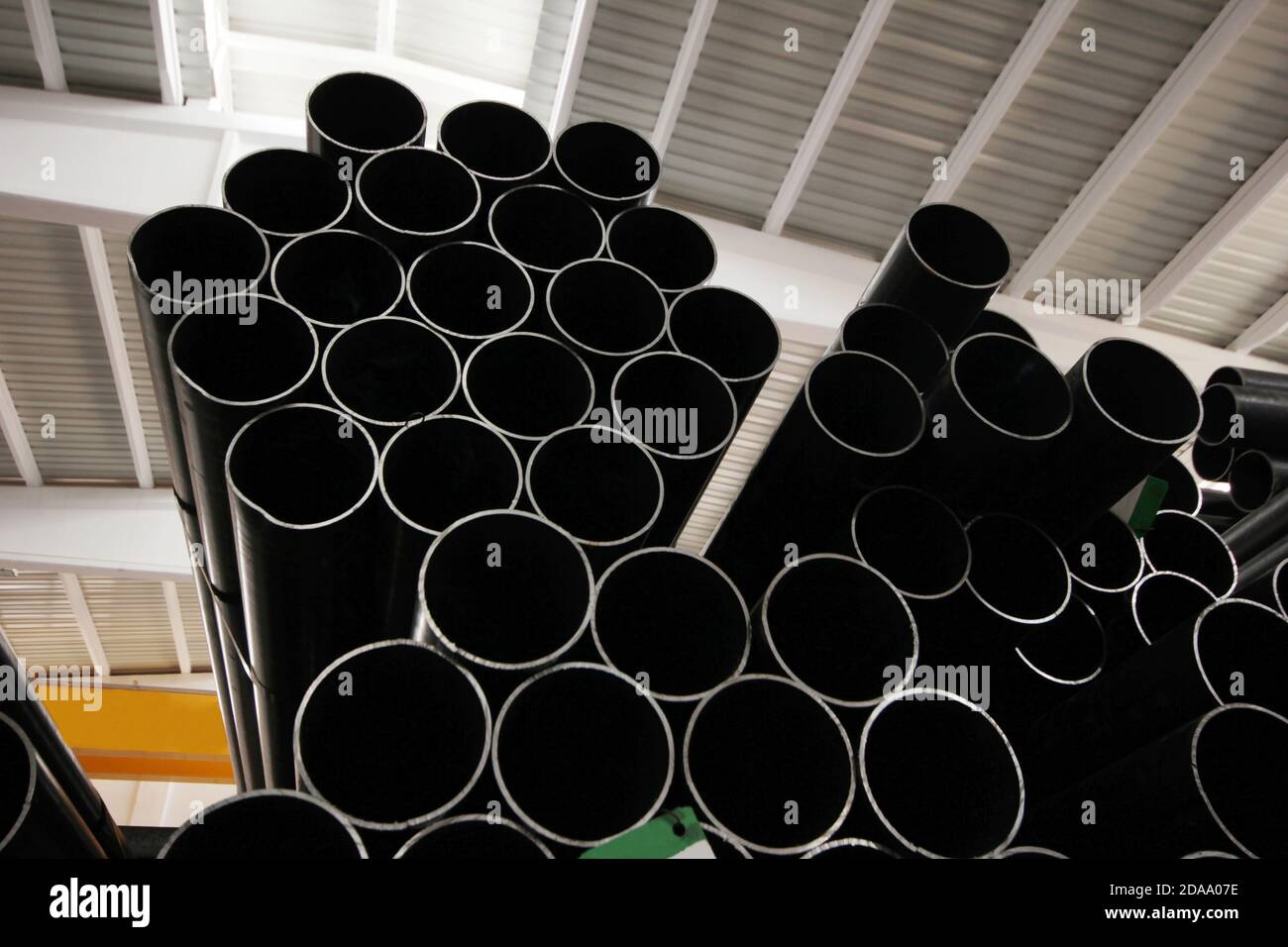 steel metal pipe stack inside factory Stock Photo - Alamy