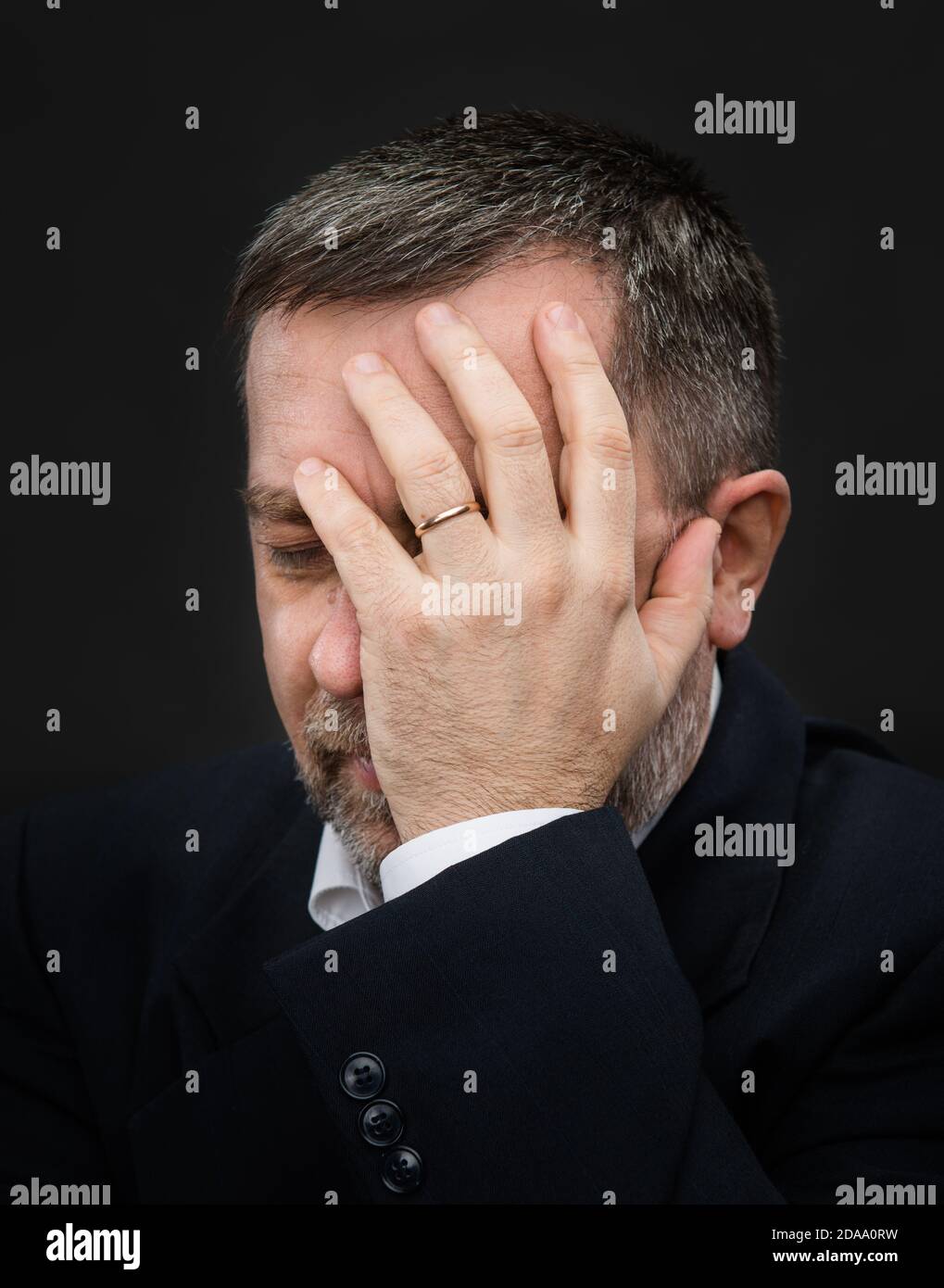 Headache. Portrait of an elderly man with face closed by hand Stock ...