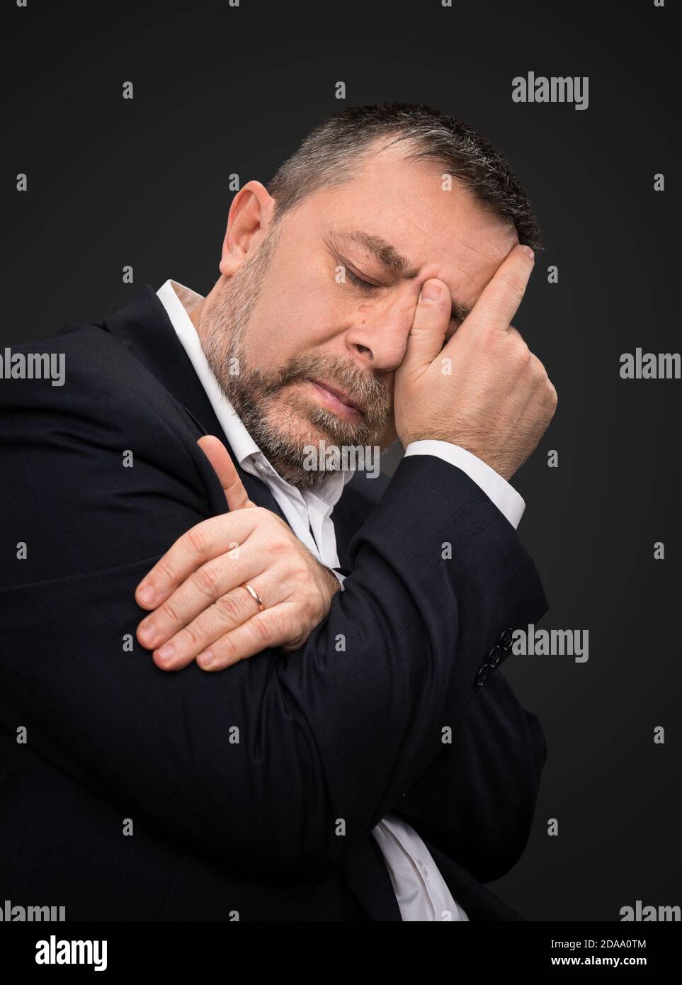 Headache. Portrait of an elderly man with face closed by hand Stock ...