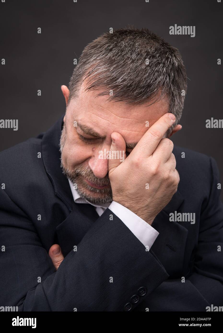 Headache. Portrait of an elderly man with face closed by hand Stock ...