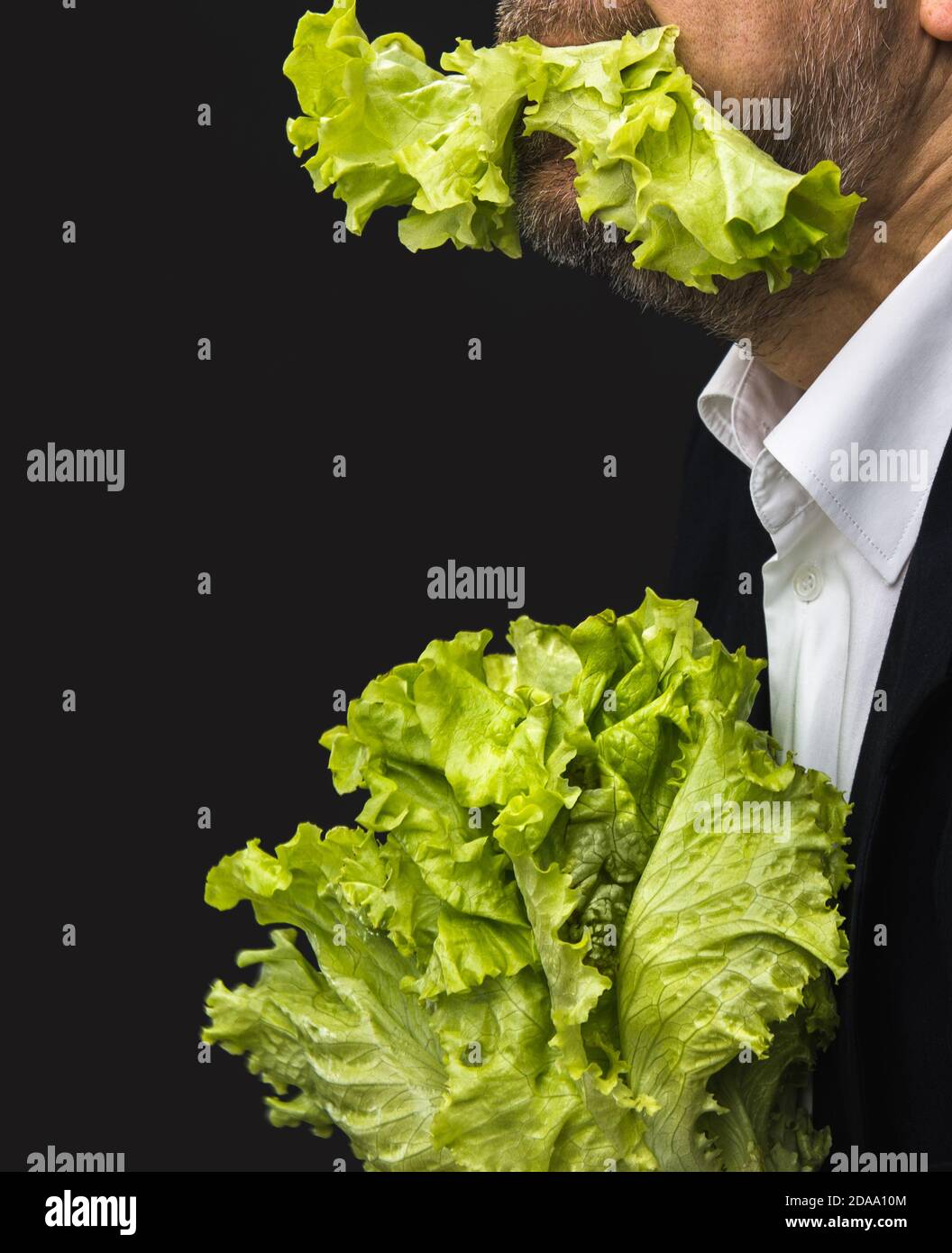 Healthy lifestyle and healthy eating concept. Man holding and eating ...