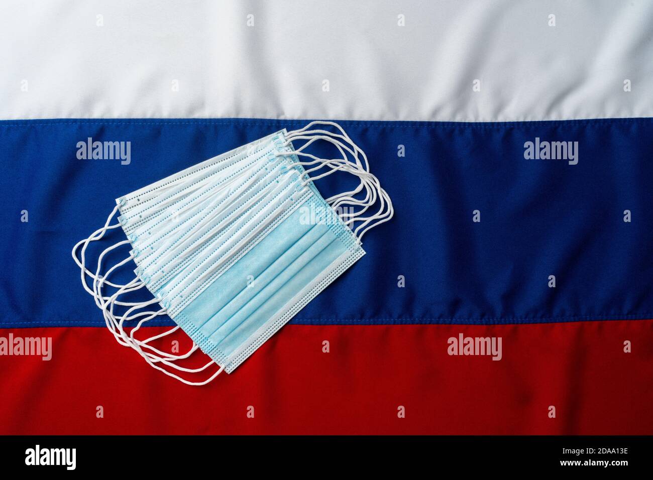 Medical face masks on flag of Russia Stock Photo - Alamy