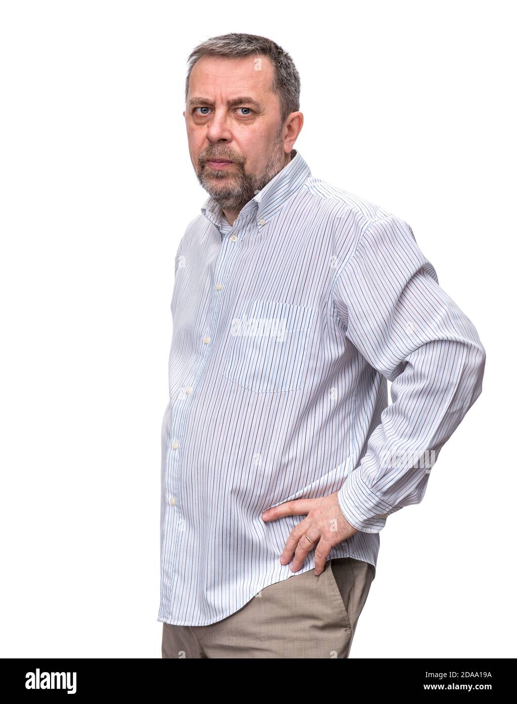 Handsome positive middle-aged business man standing and thinking ...