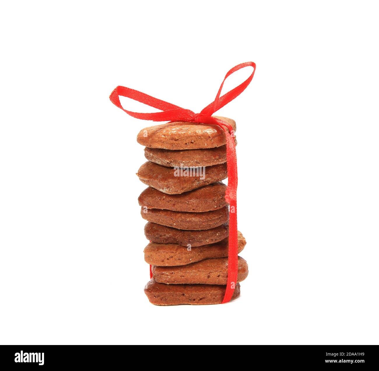 Closeup shot of a nicely packaged gingerbread cookies with a red ribbon ...