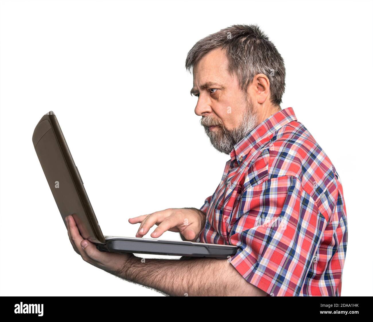 Portrait Of middle aged businessman holding laptop isolated on white ...