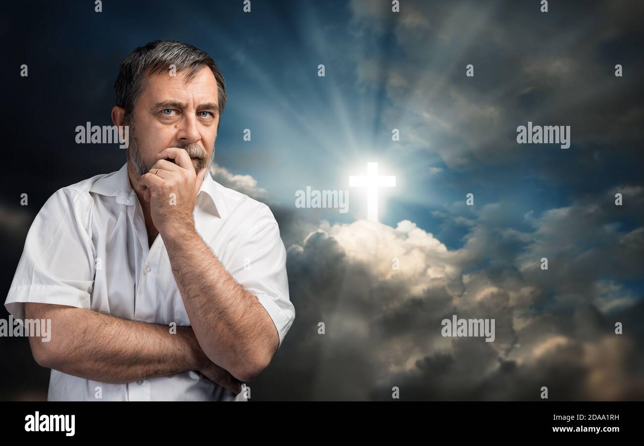 Religious conversion concept. Elderly man thinking about faith and God ...