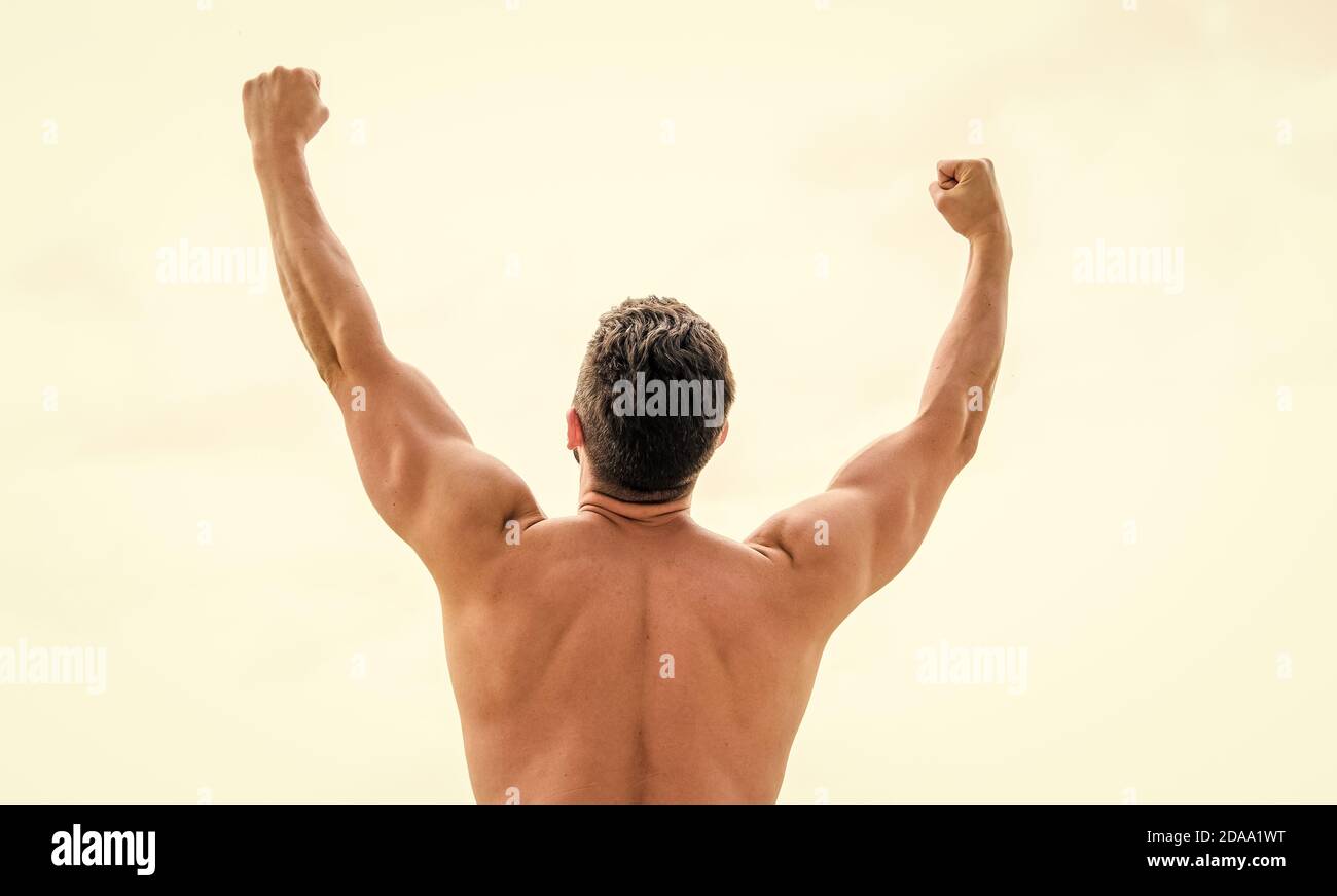 completely successful. Morning stretching. Man muscular back stretching ...
