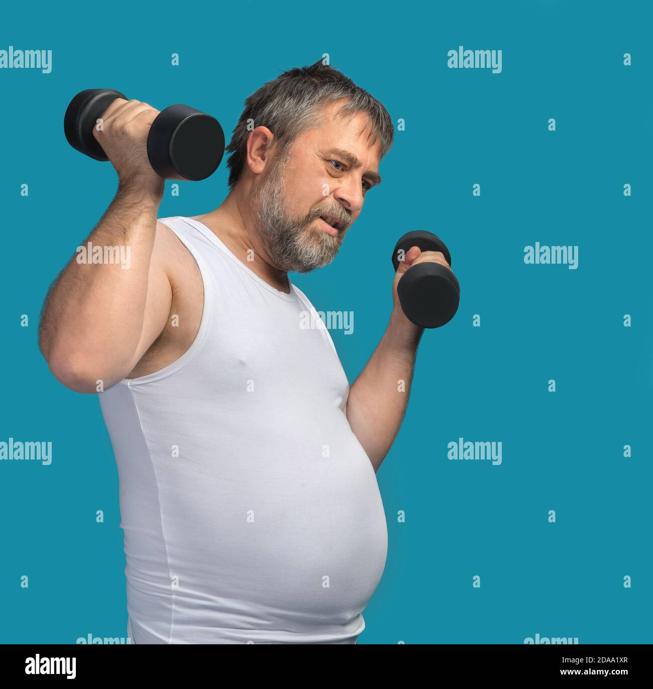 Hard work for a healthy lifestyle concept. Fat middle-aged man with a ...
