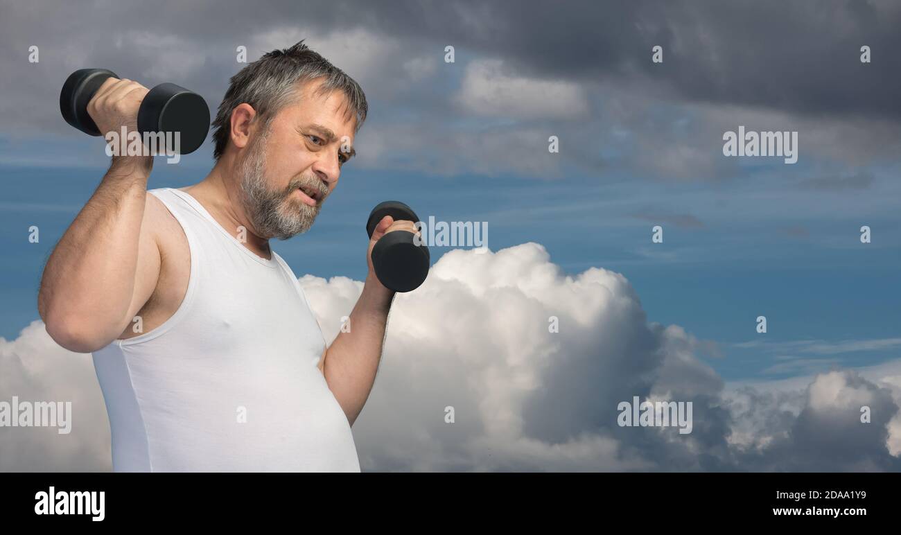 Hard work for a healthy lifestyle concept. Fat middle-aged man with a ...