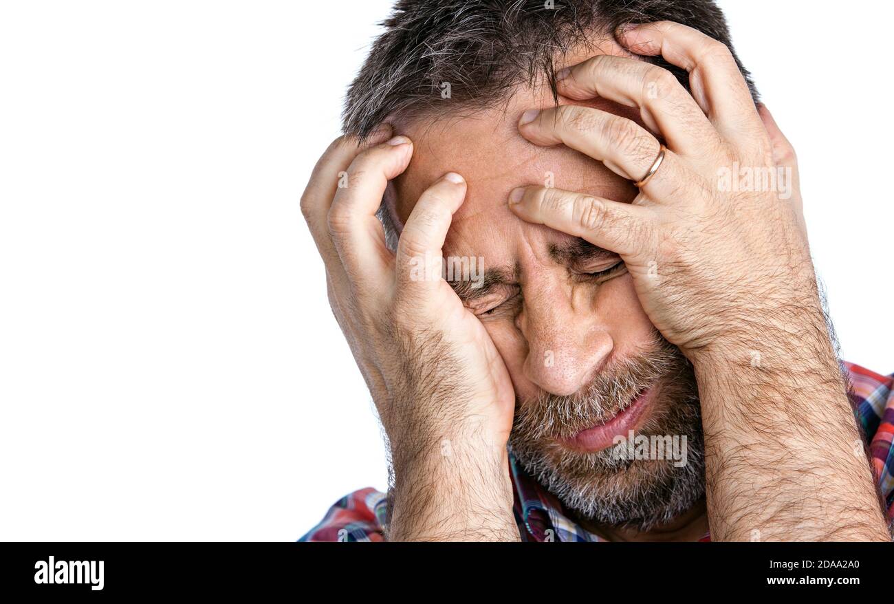 Headache. Portrait of an middle age man with face closed by hand ...
