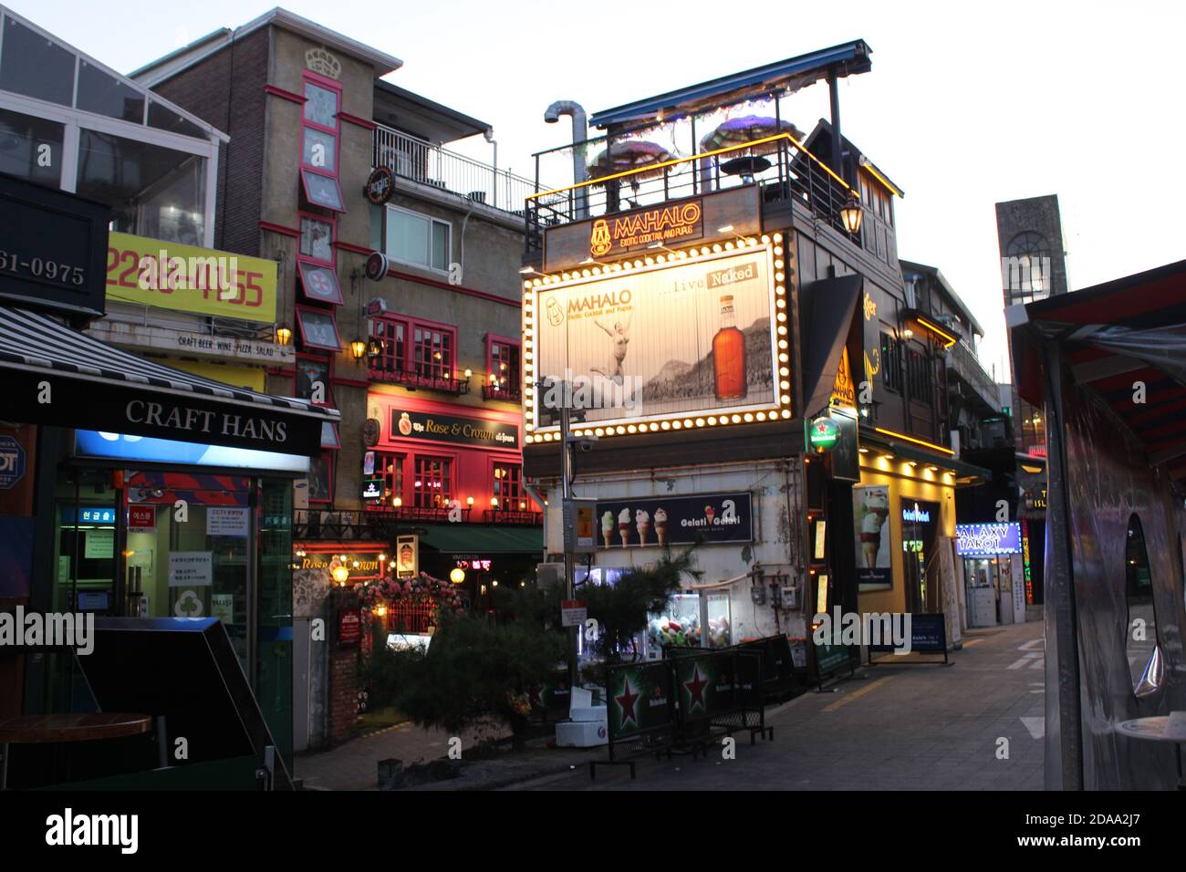 Twilight view of cafes, pubs, and restaurants in Itaewon, Seoul, Korea ...