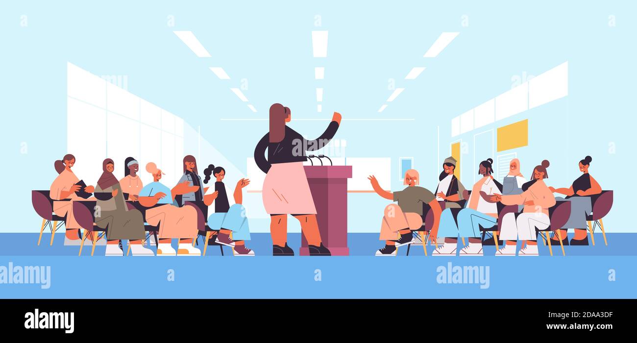 group of mix race female friends discussing during meeting in women's ...