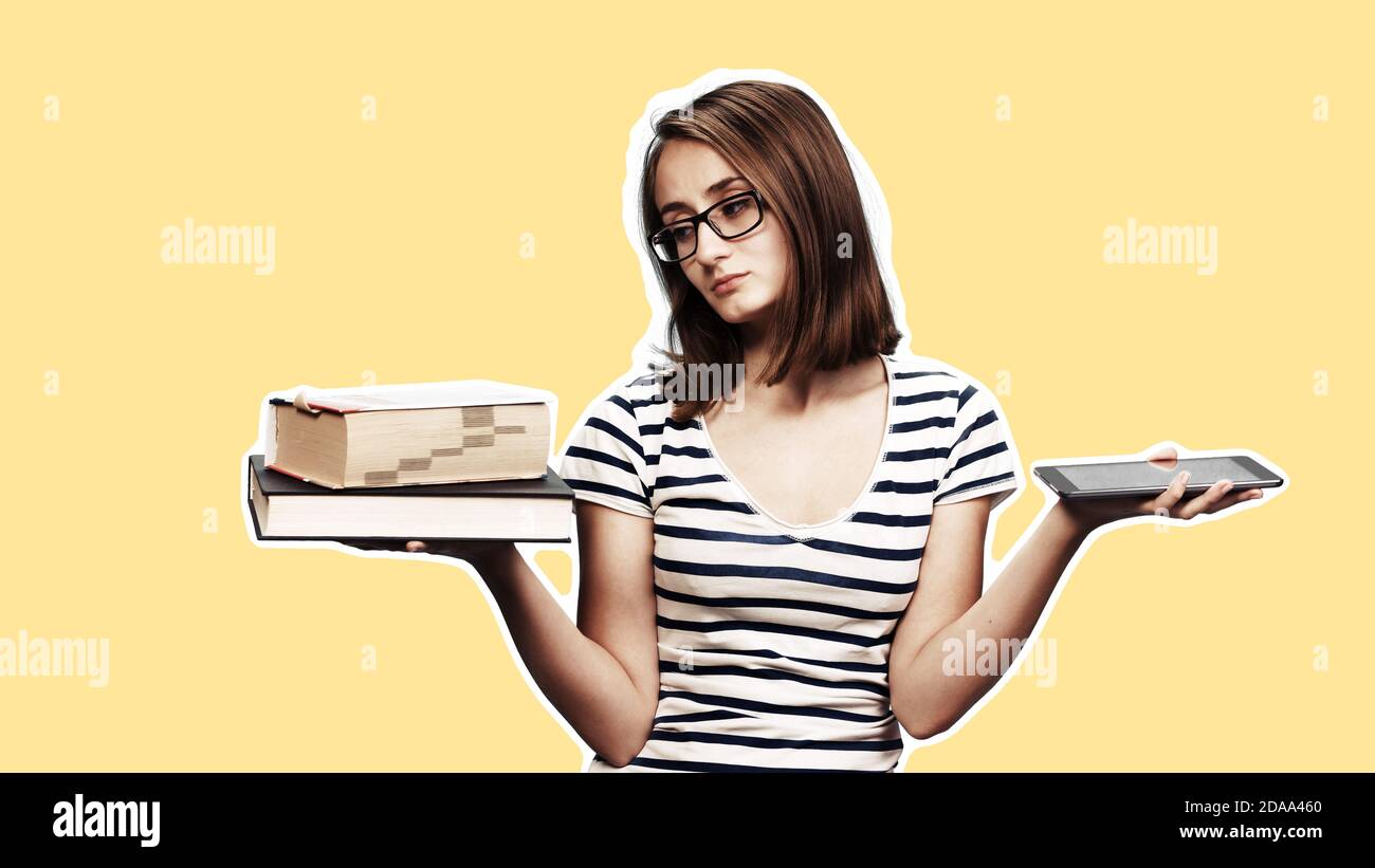 Contemporary education concept. Book vs e-book. Girl student holding ...