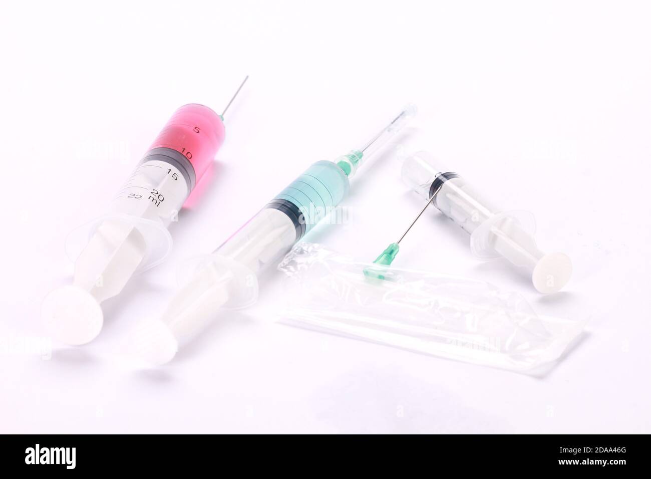 Low angle shot of medical syringes ready for injection isolated on ...