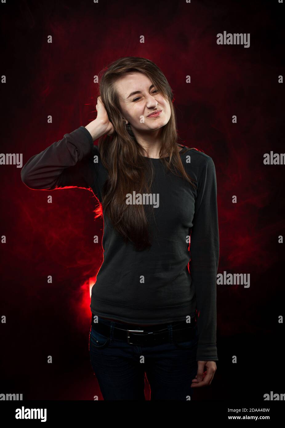 Teenage girl scratches the back of the head. Fashion, portrait and ...