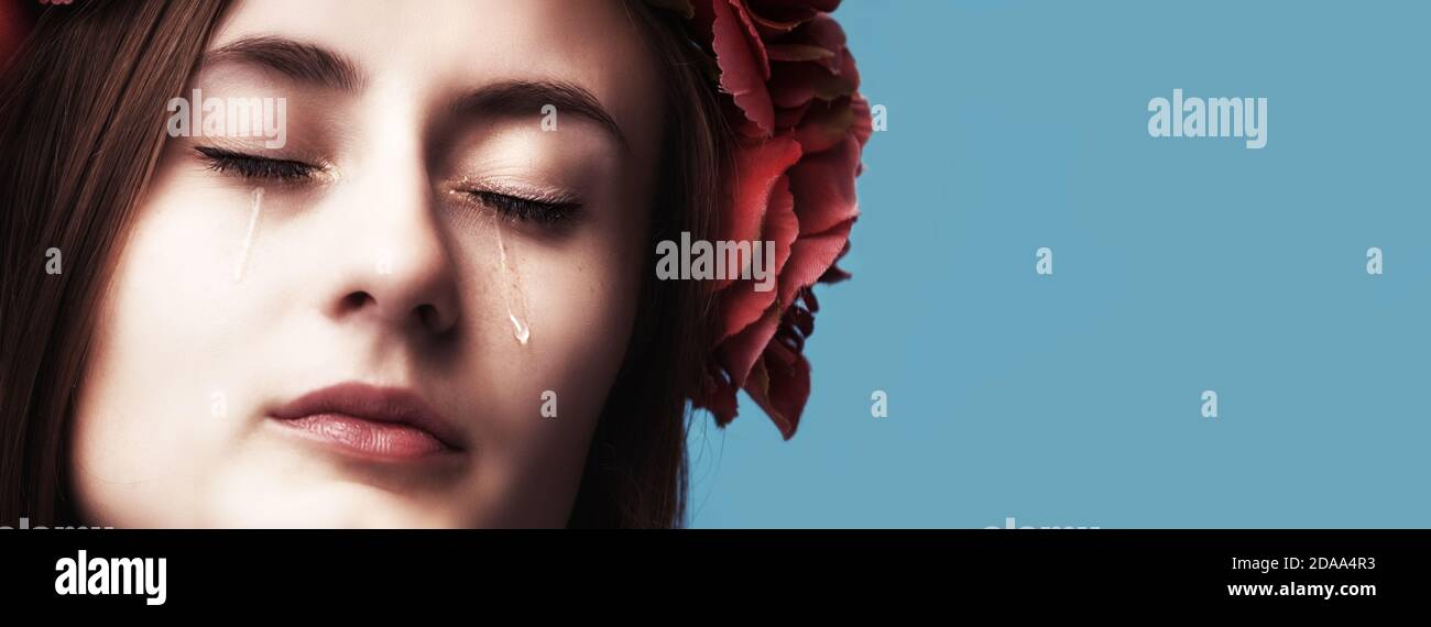 Close-up portrait of beautiful crying girl with tears on her cheeks on ...