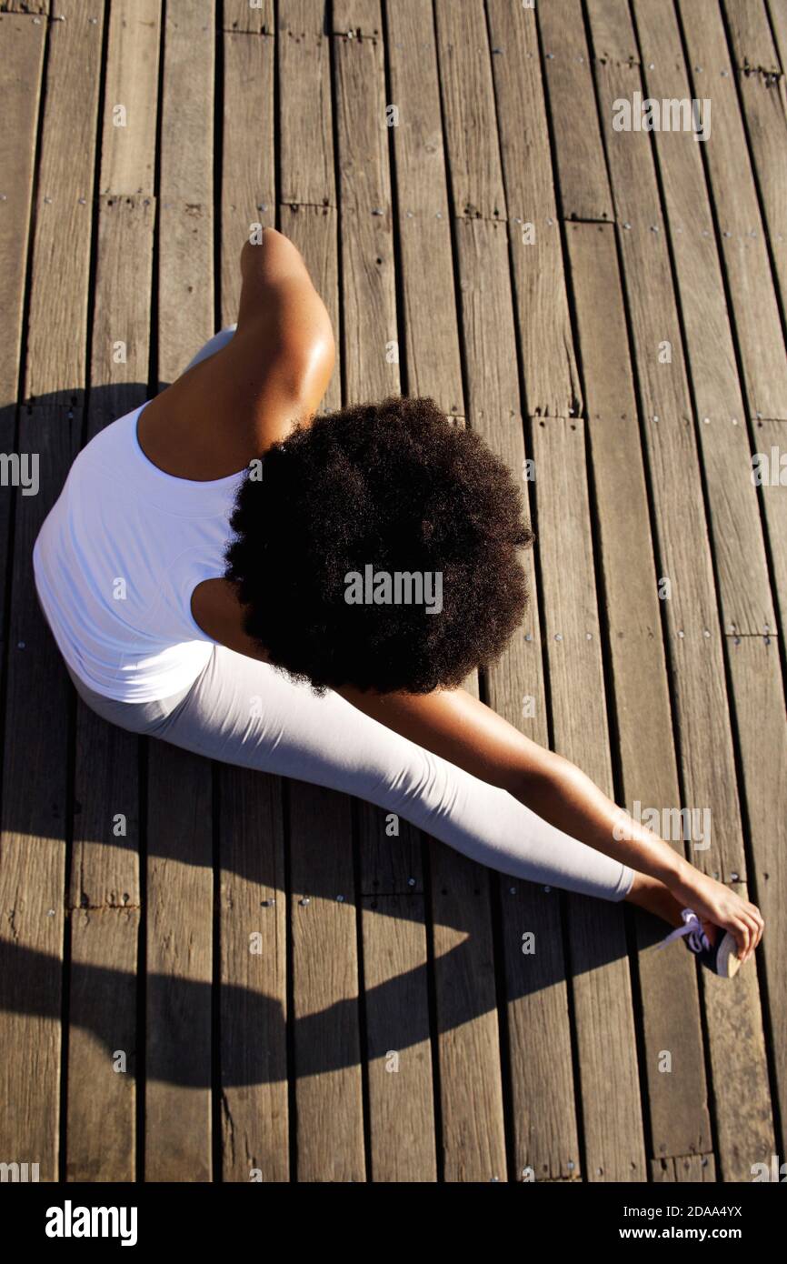 African Woman Sitting Hands On Legs High Resolution Stock Photography ...