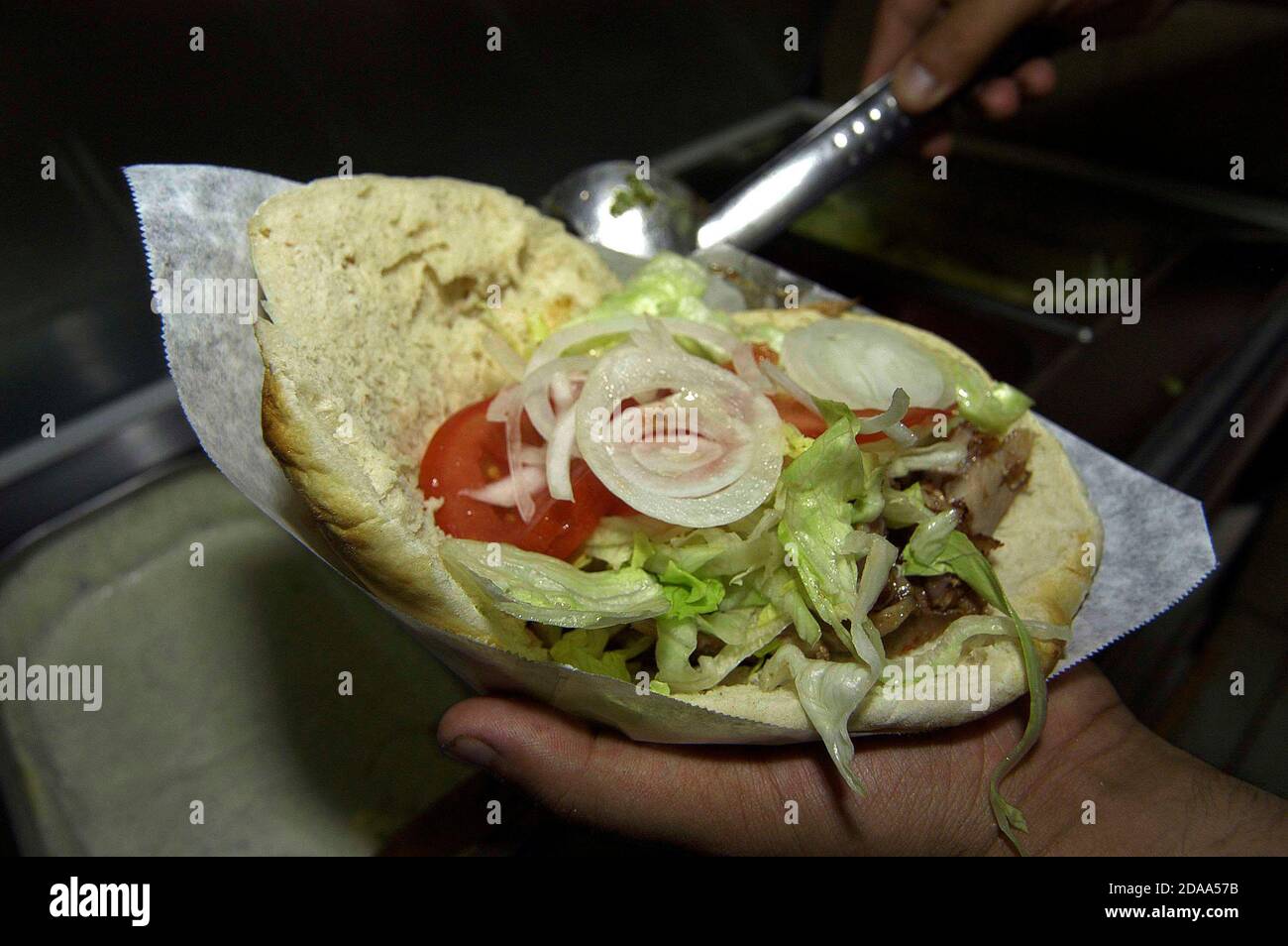 Fat man eating kebab hi-res stock photography and images - Alamy