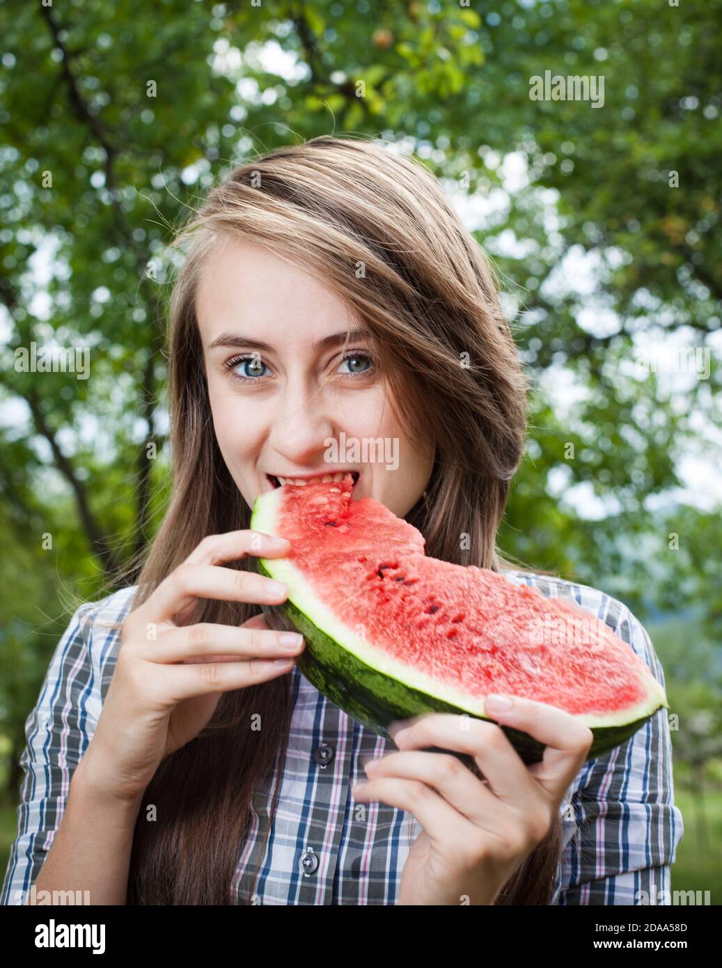 Young woman with watermelon outdoors Stock Photo - Alamy
