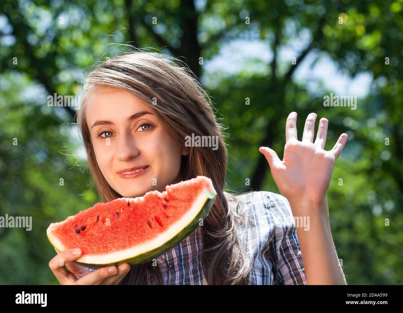 Young woman with watermelon outdoors Stock Photo - Alamy