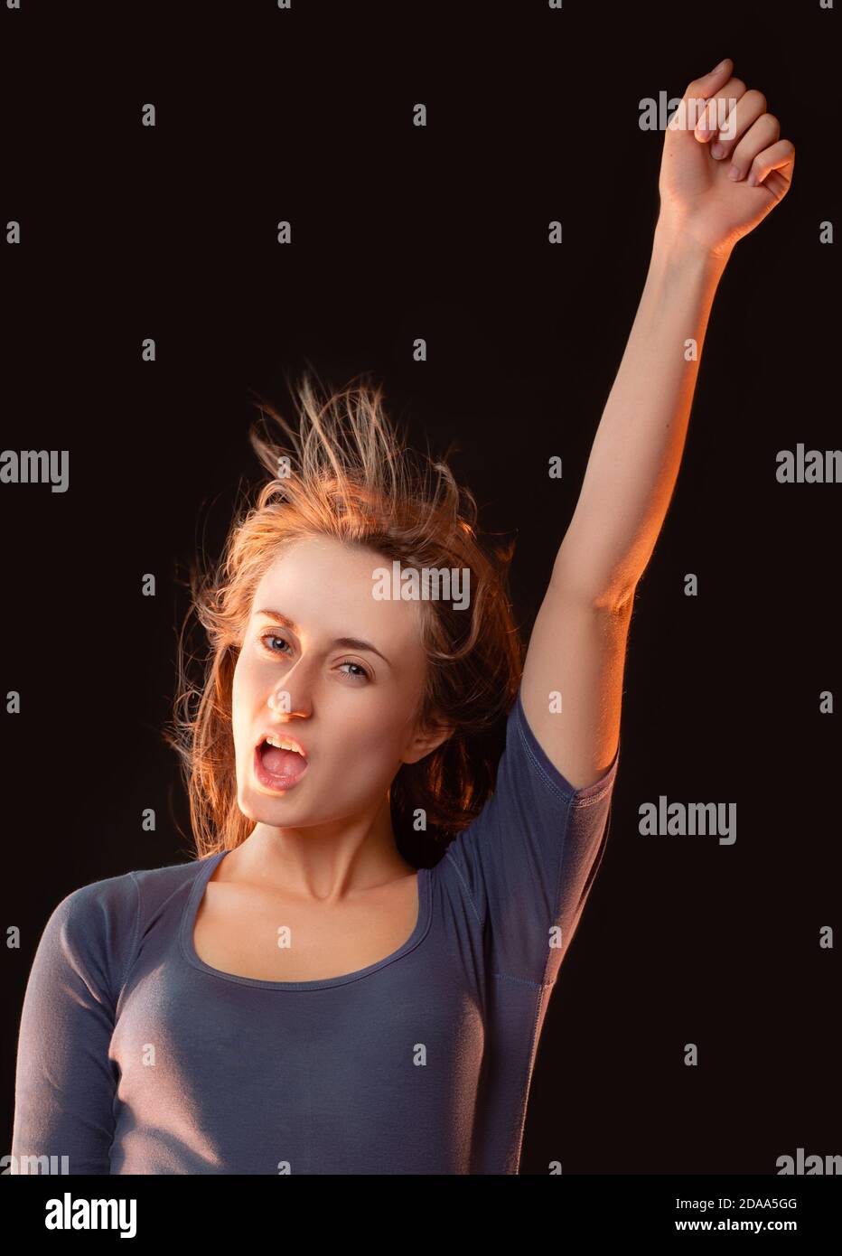 Portrait of emotional girl with her hand raised Stock Photo - Alamy