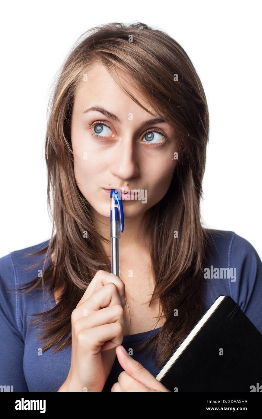 student with a pen and a notebook on a white background Stock Photo - Alamy