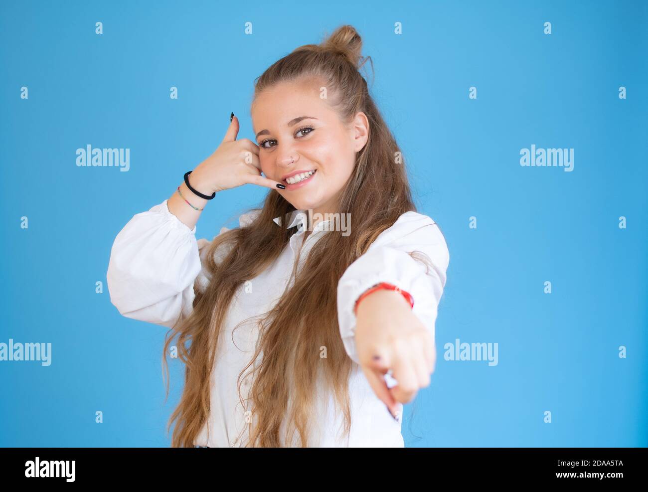 Call me Gesture by Beautiful Girl, blue background in Studio Stock ...