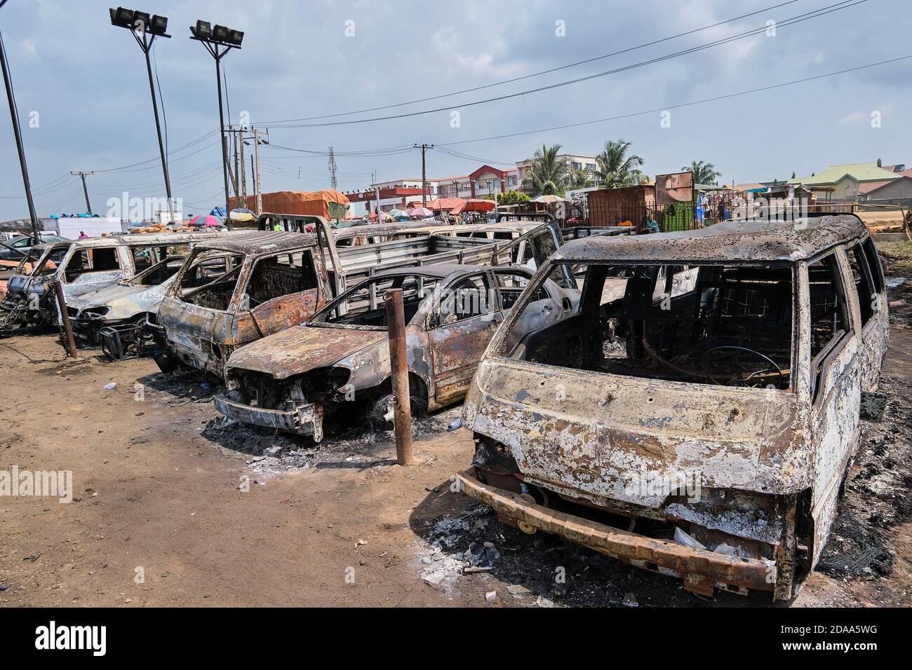 Damaged vehicles are seen at a site following an explosion after a ...