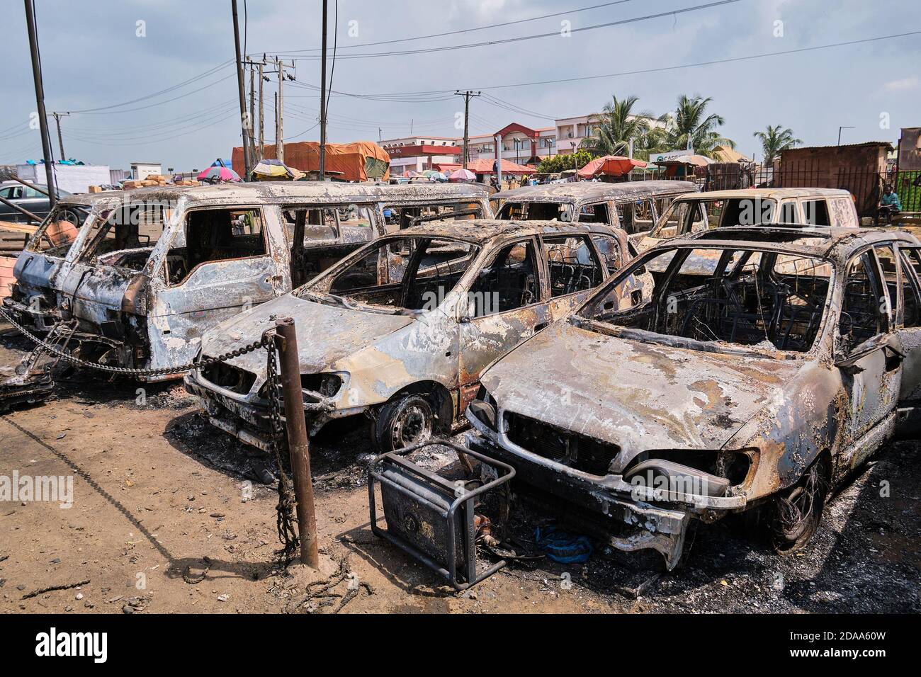 Damaged vehicles are seen at a site following an explosion after a ...