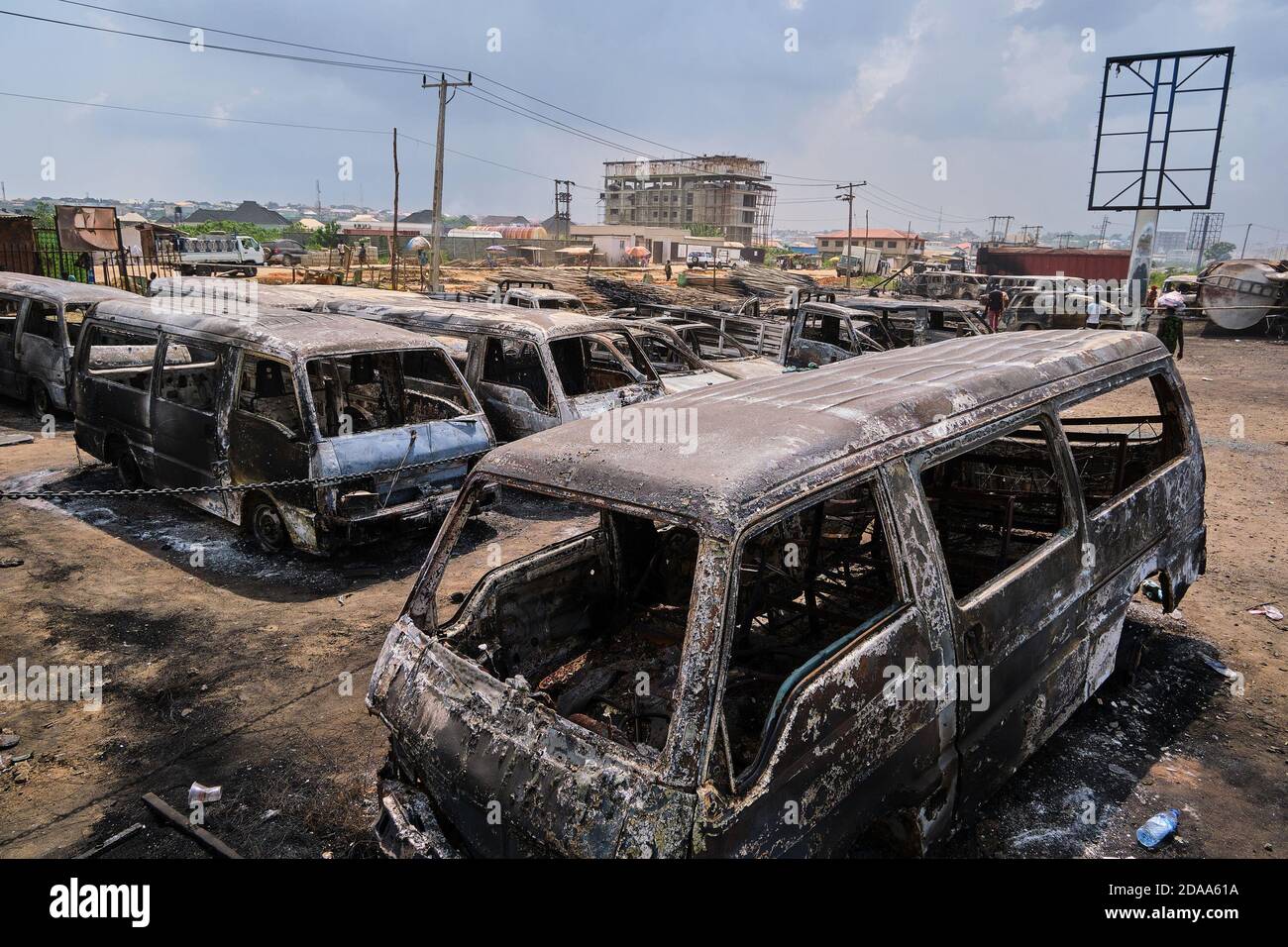 Damaged vehicles are seen at a site following an explosion after a ...