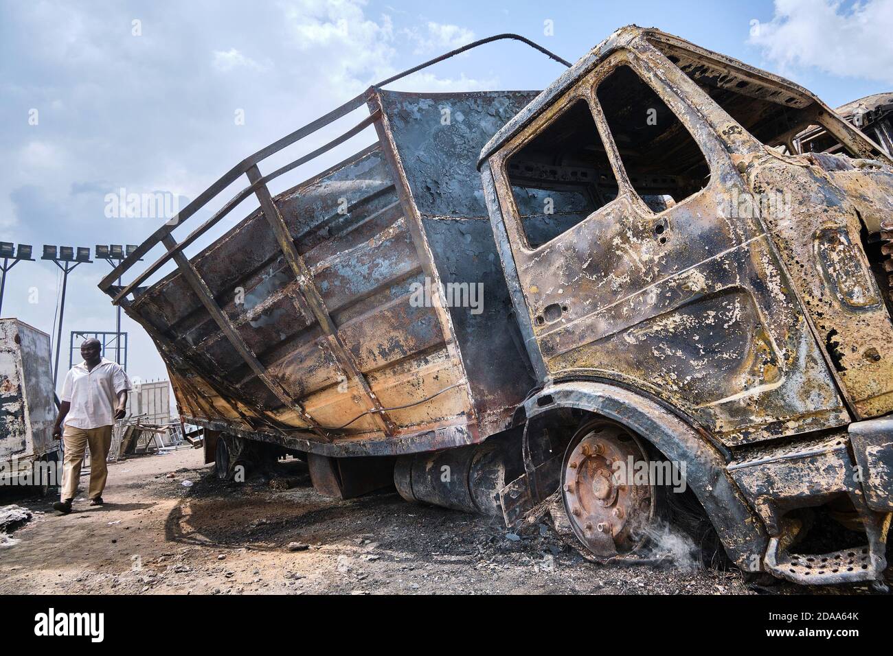 Damaged vehicles are seen at a site following an explosion after a ...
