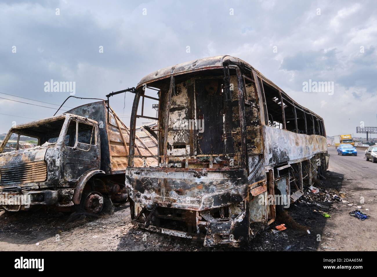Damaged vehicles are seen at a site following an explosion after a ...
