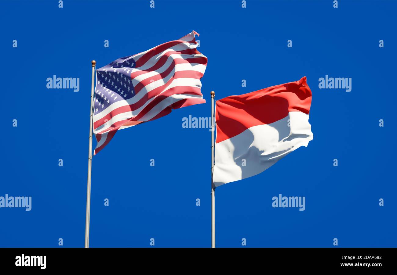 Beautiful national state flags of Indonesia and USA together at the sky ...
