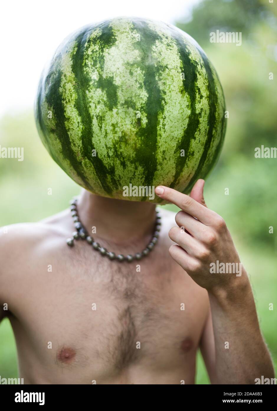 Humorous photo of a boy with a watermelon instead of head Stock Photo ...