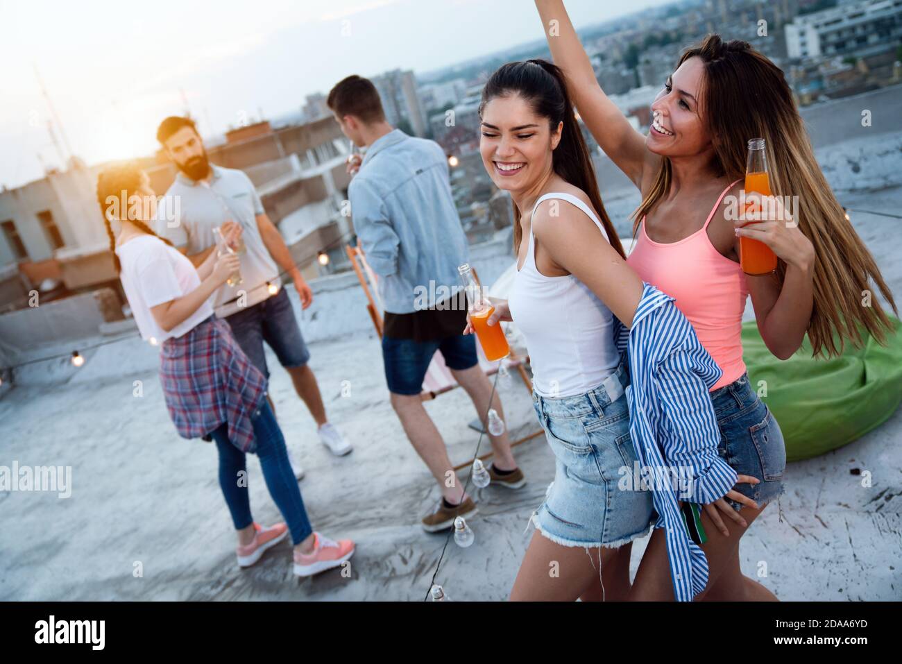 Group of happy young people friends dancing and having fun in party ...