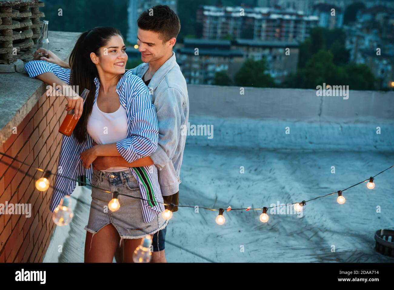 Happy lovely couple having fun time at party Stock Photo - Alamy