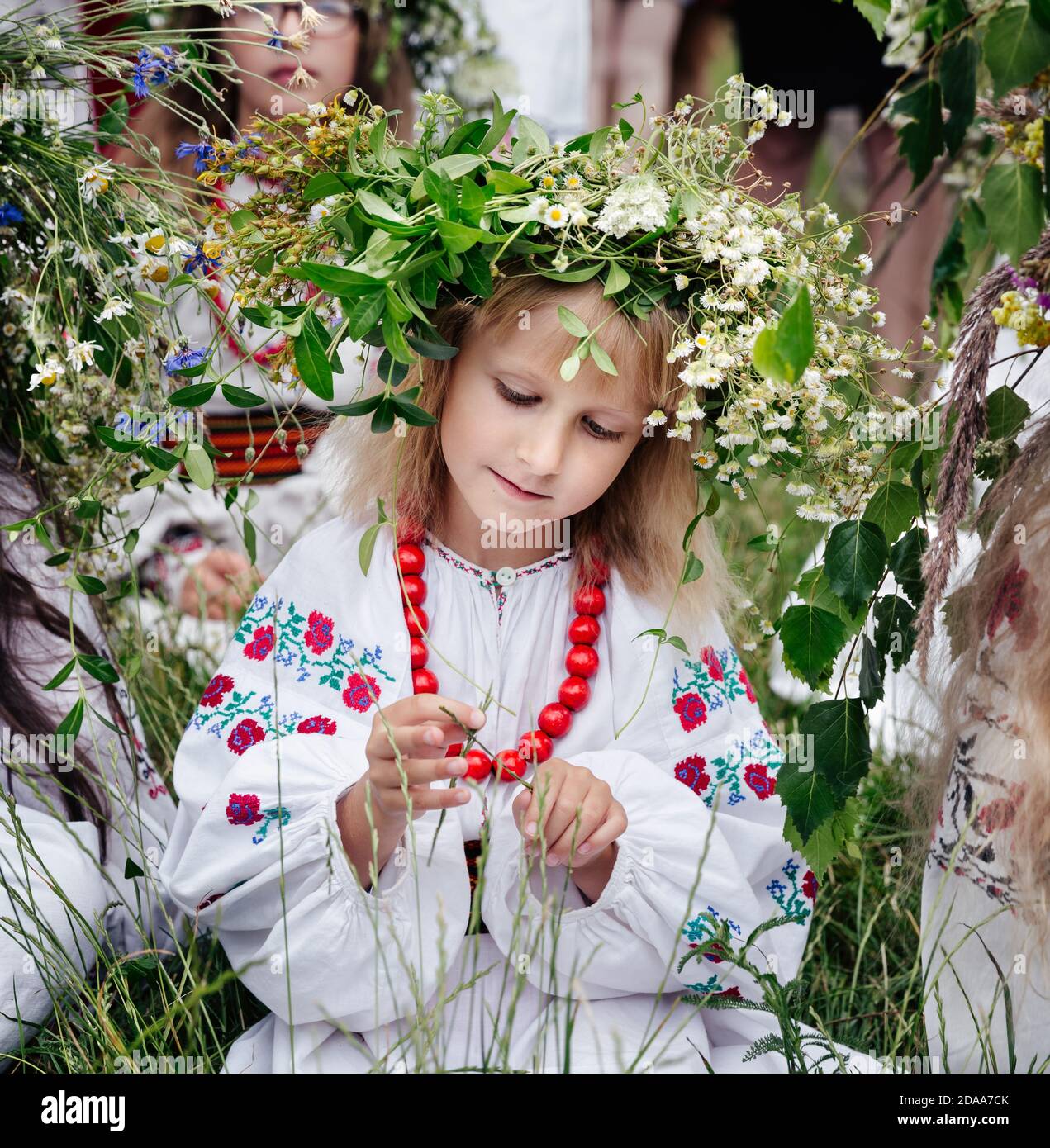 KIEV, UKRAINE - Jul 06: Young girls wear wreaths of flowers celebrating ...
