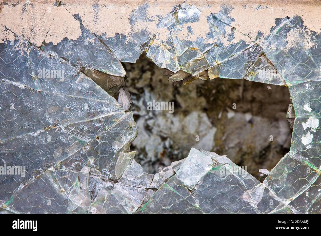Old damaged glass reinforced with wire mesh Stock Photo - Alamy