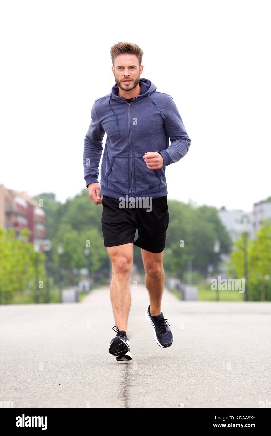 Full length portrait of active middle age runner outside Stock Photo ...