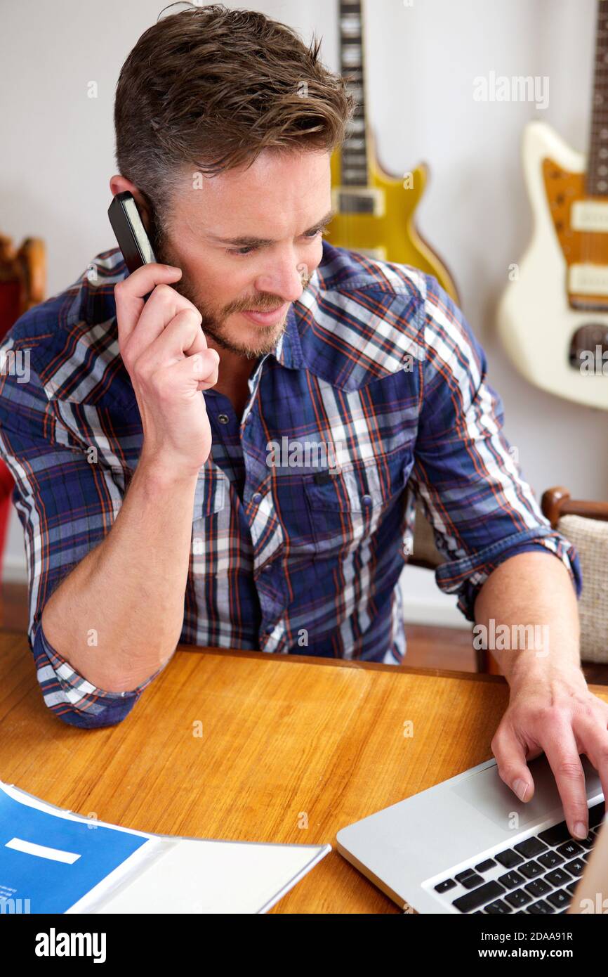 Portrait of handsome older man on call at music studio Stock Photo - Alamy