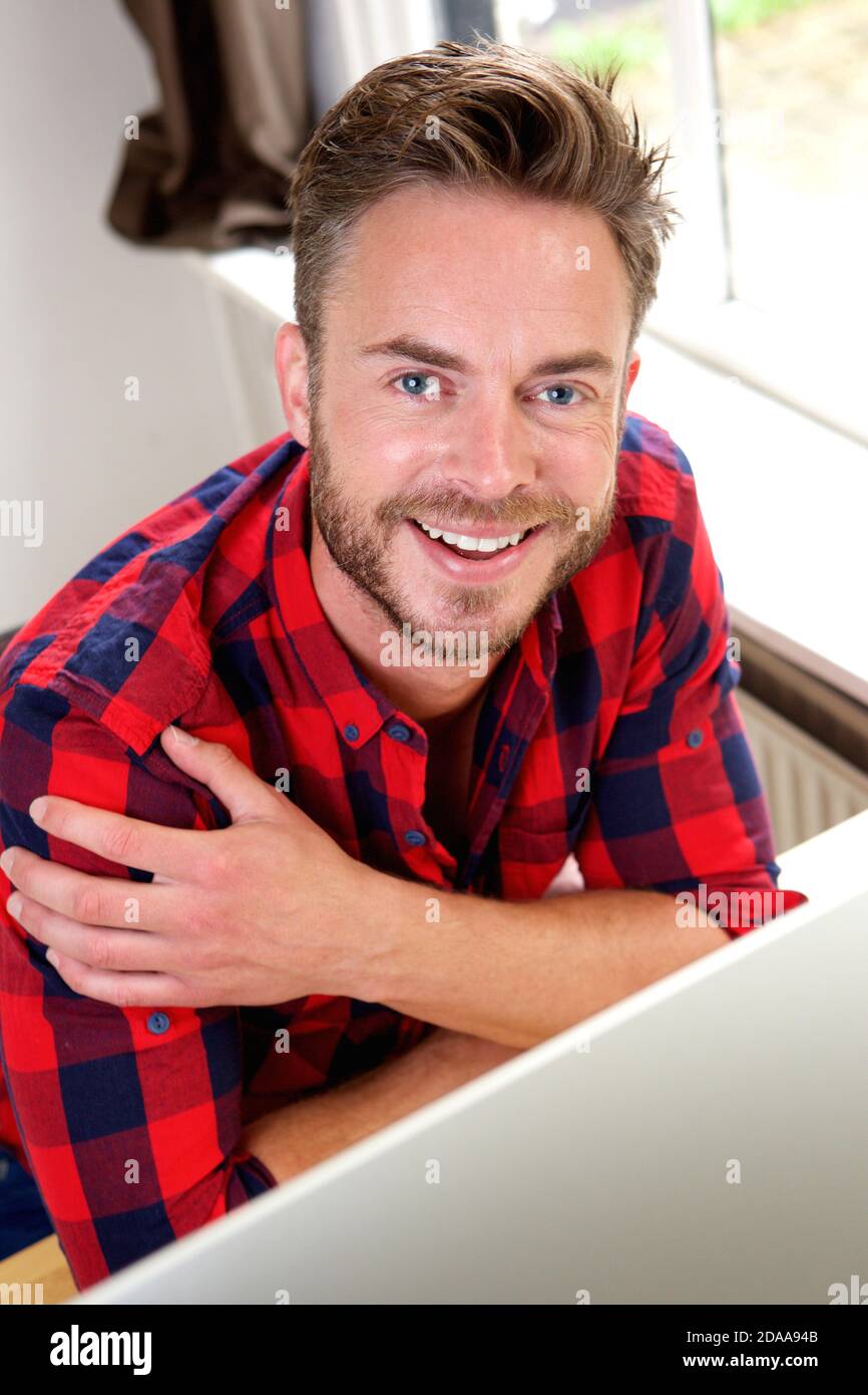 Confident smiling male model hi-res stock photography and images - Alamy