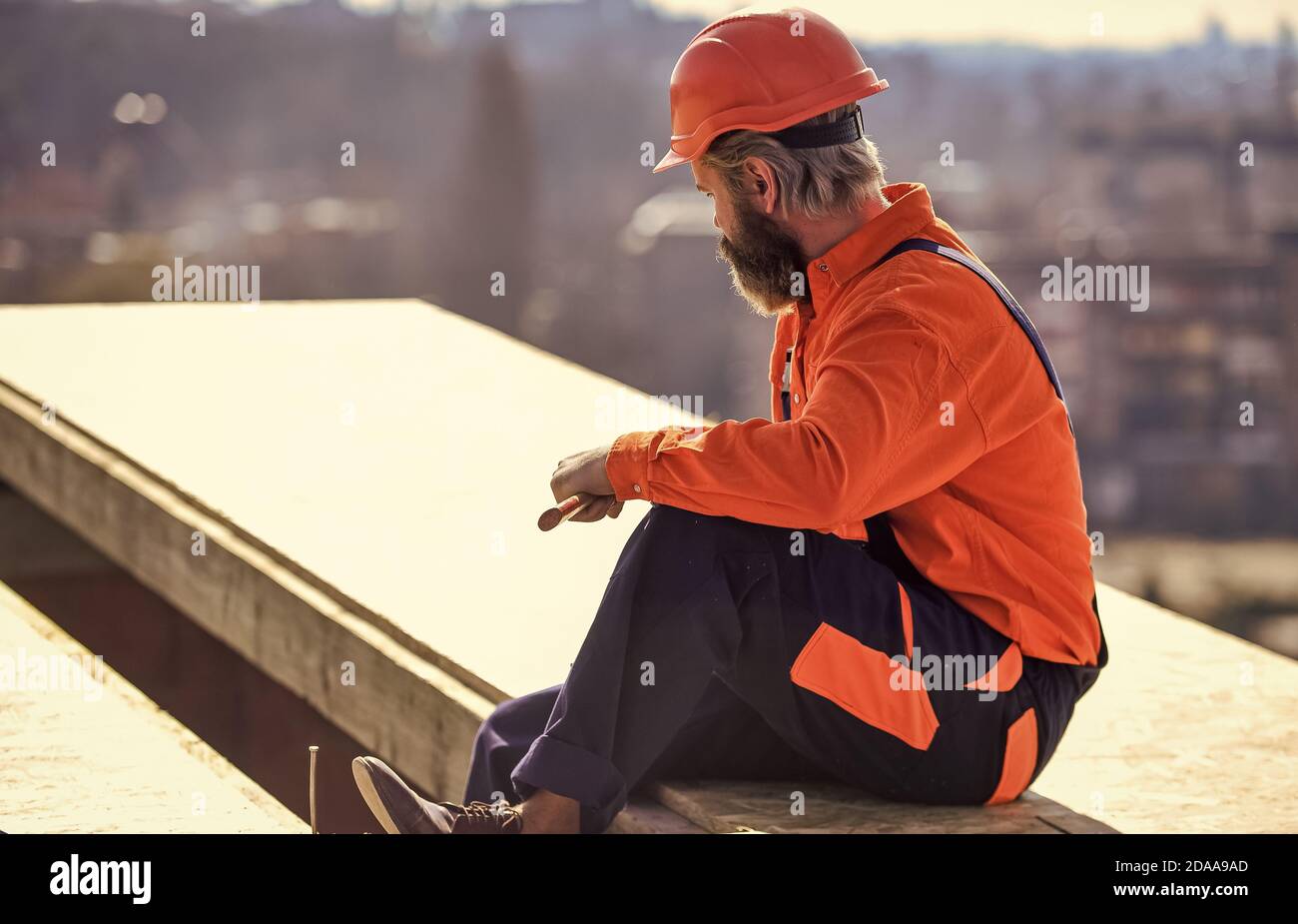 Install partially overlapping layers of material over roof insulation ...